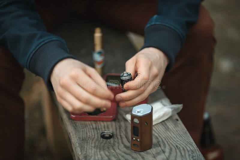 Vape. Electronic Cigarette in Male Hands. Personal Vaporizer. Stock ...