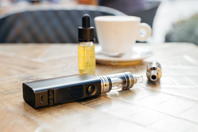 Vape or E-cigarette. Vaping Set on the Table. Stock Photo - Image of ...
