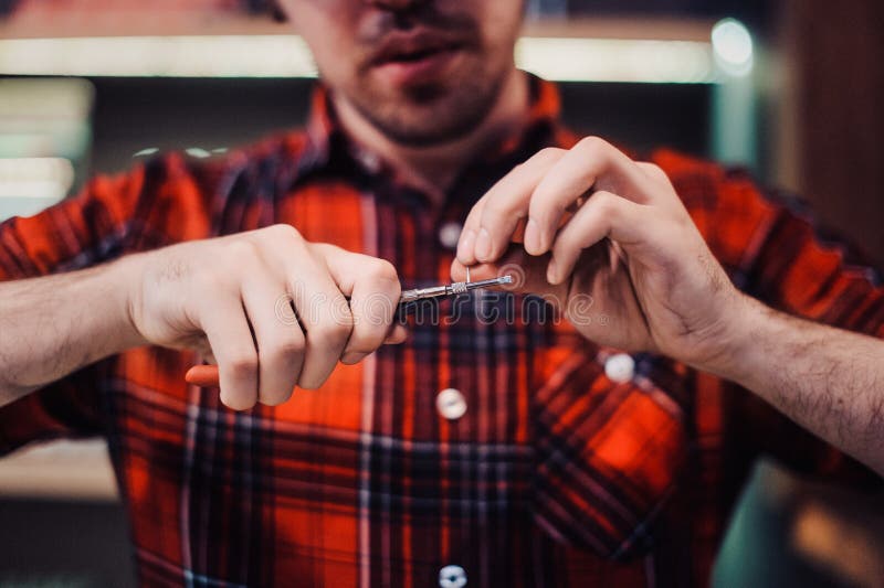 The Process of Servicing the Mechanical Vape Device. Master Replace ...