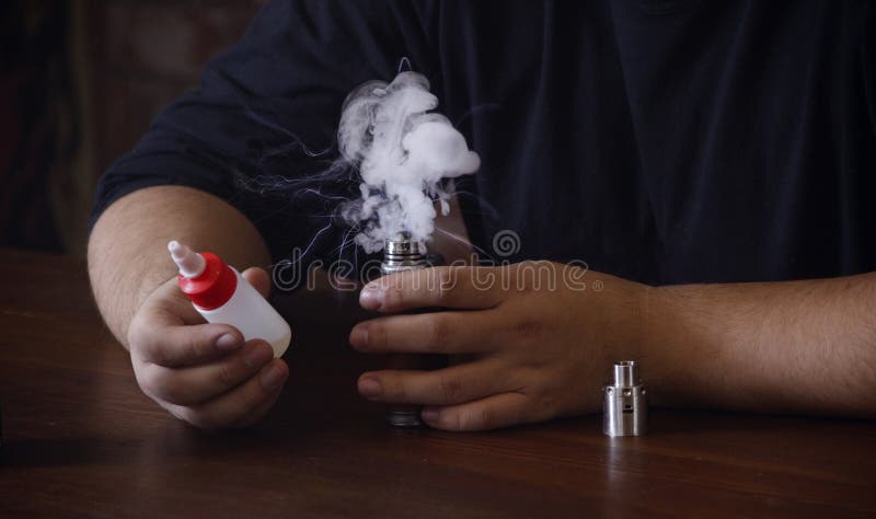 Vaping Device in in the Woman`s Hand. Stock Photo - Image of ejuice ...