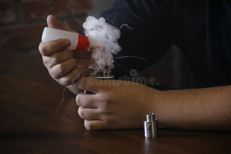 Vaping Device in in the Woman`s Hand. Stock Photo - Image of ejuice ...
