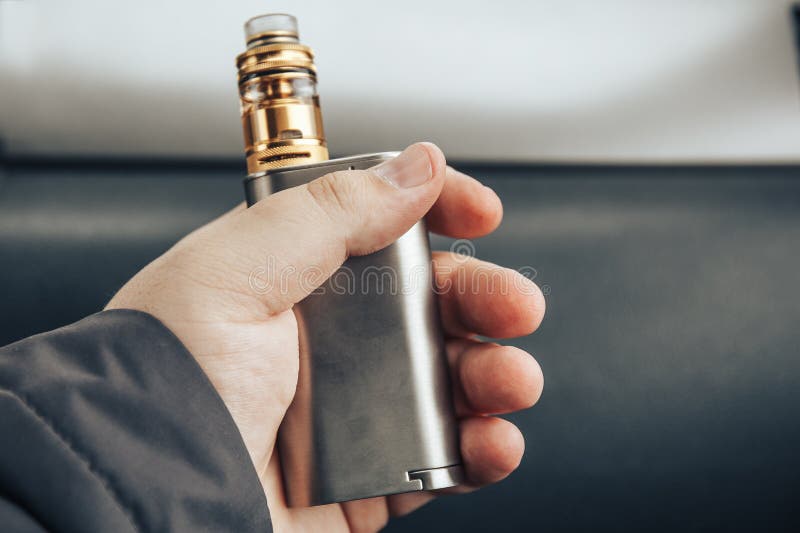 Vaping Device in the Man`s Hand. Electronic Cigarette Stock Photo ...