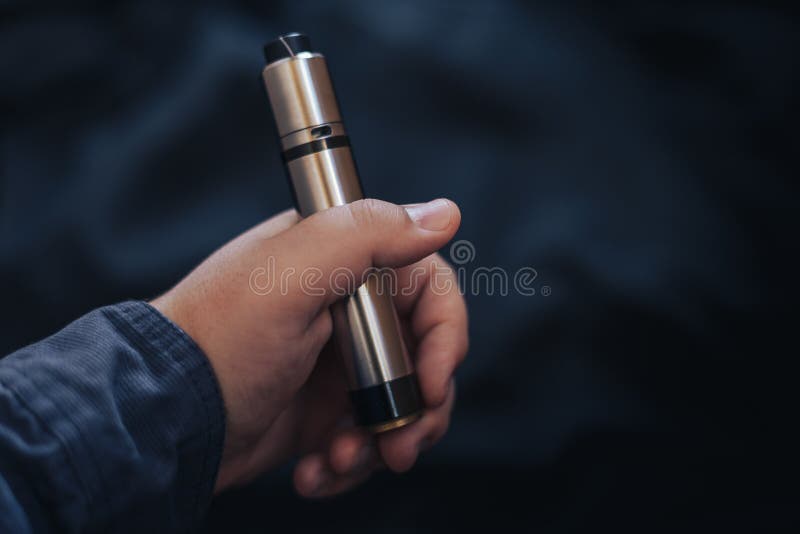 Vaping Device in in the Man`s Hand. Electronic Cigarette, Vape Stock ...