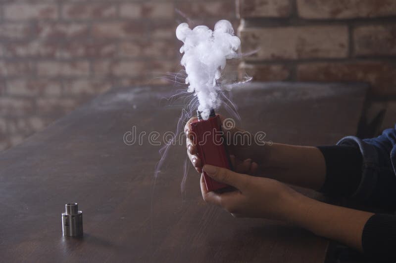 Vaping Device in in the Woman`s Hand. Stock Photo - Image of ejuice ...