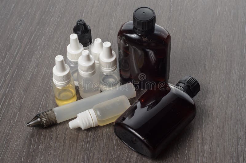 Vaping E-cigarette Liquid on Wooden Background Stock Image - Image of ...
