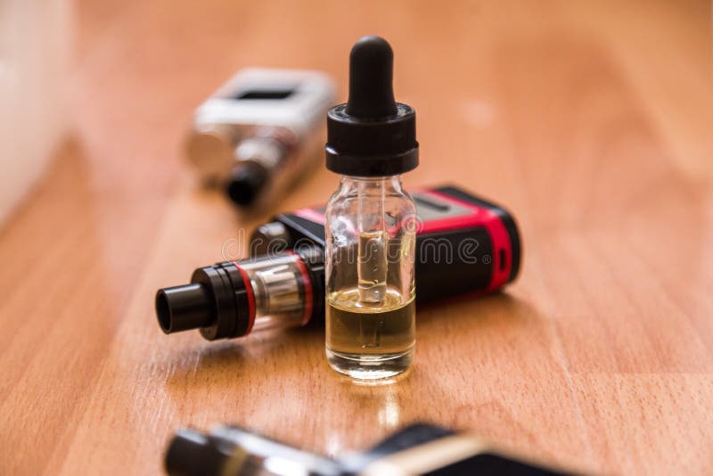 Vaping Electronic Mod and Vape Liquid. Stock Photo - Image of eliquid ...