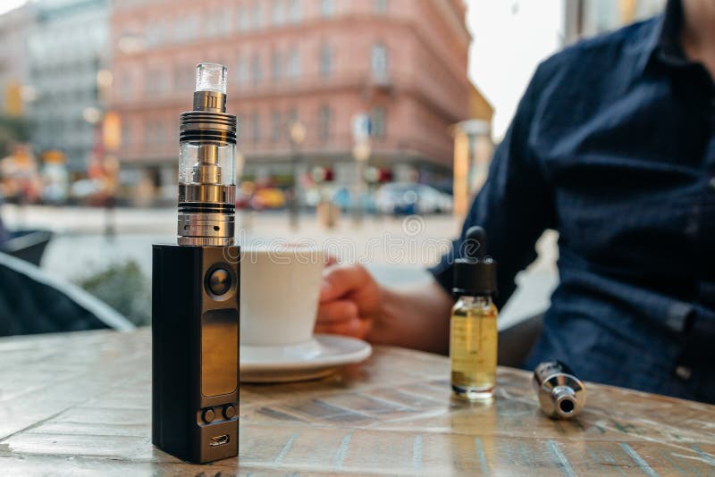 Vaping Set on the Table Against the Background of the City Stock Photo ...