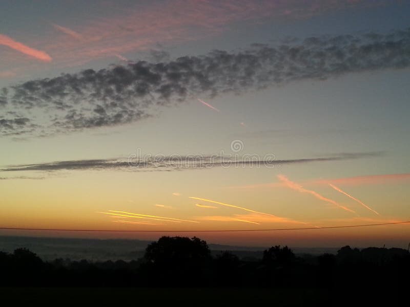 Vapour Trails in the Sunrise Stock Image - Image of scenic, morning ...