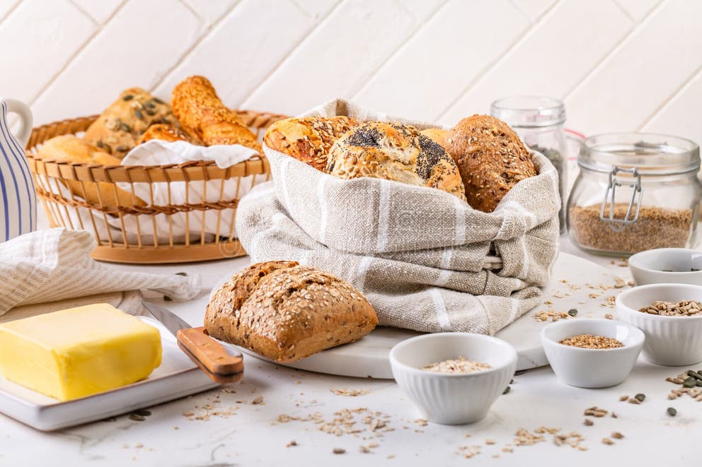 Variation of Bread Rolls or Buns in Breadbag with Butter and Assorted ...