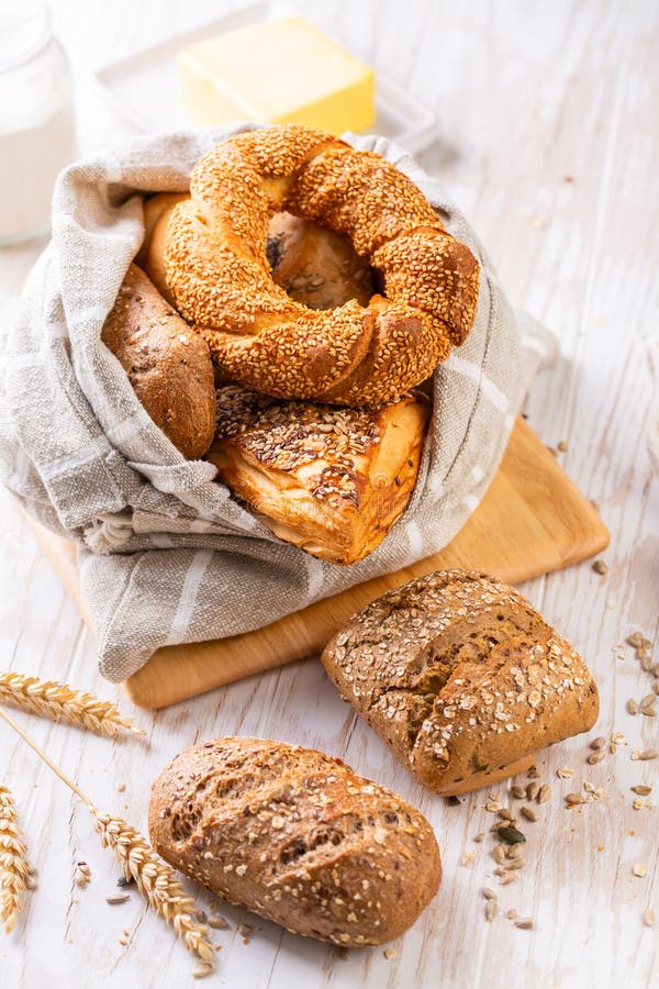 Variation of Bread Rolls or Buns in Breadbag with Butter and Assorted ...