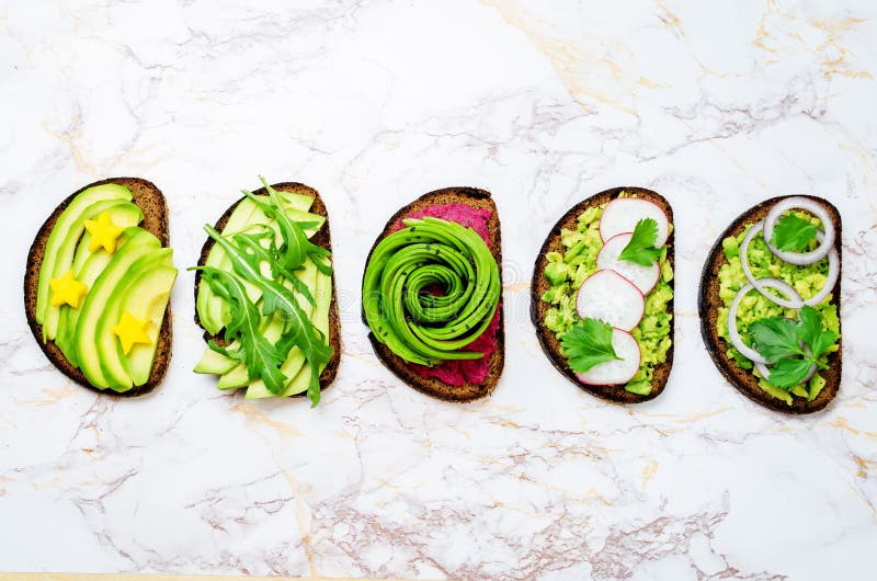 Variation of Healthy Rye Breakfast Sandwiches with Avocado and Toppings ...