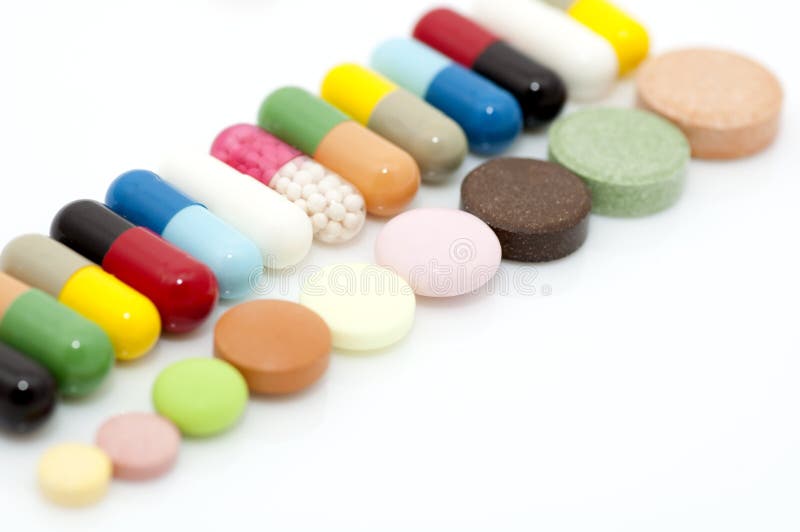 Varie Capsule E Compresse Nella Fila Fotografia Stock - Immagine di ...