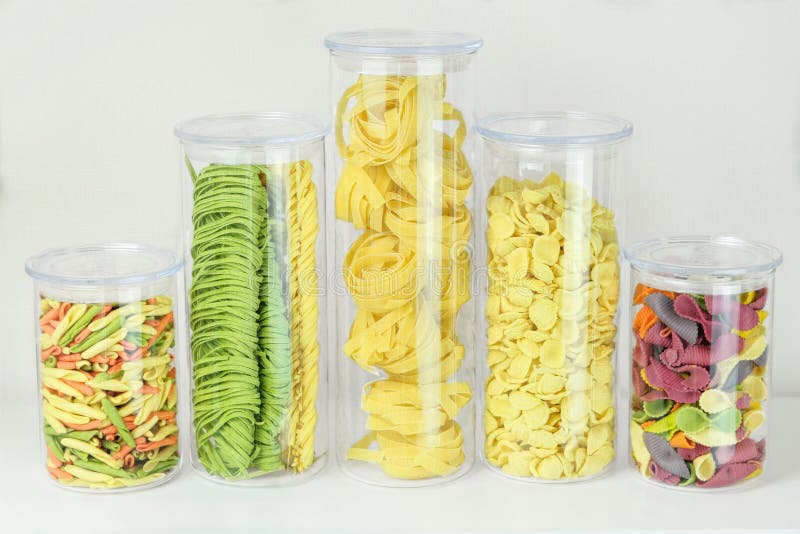 Varieties of Multi-colored Pasta in Glass Containers. Types of Uncooked ...