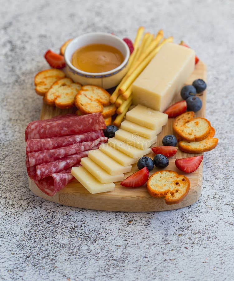Appetizer set on board stock photo. Image of salami - 163870438