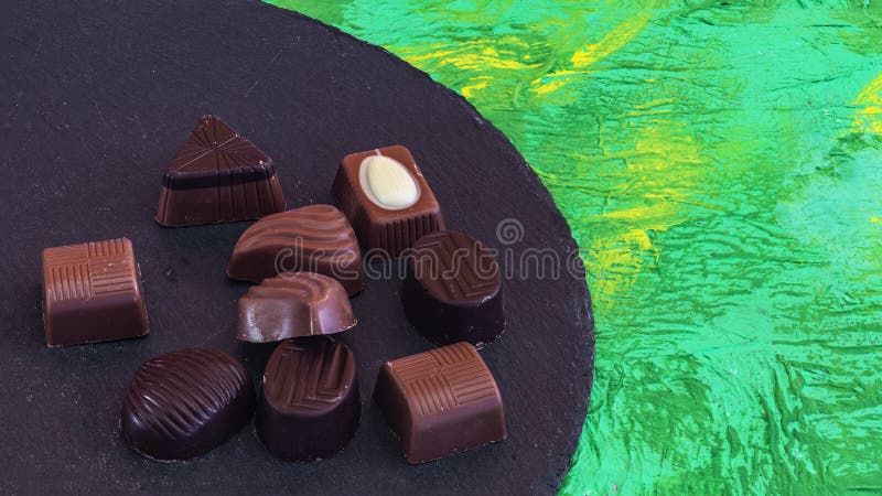Variety of Assorted Flavors Chocolate Candies on Stone Plate Stock ...