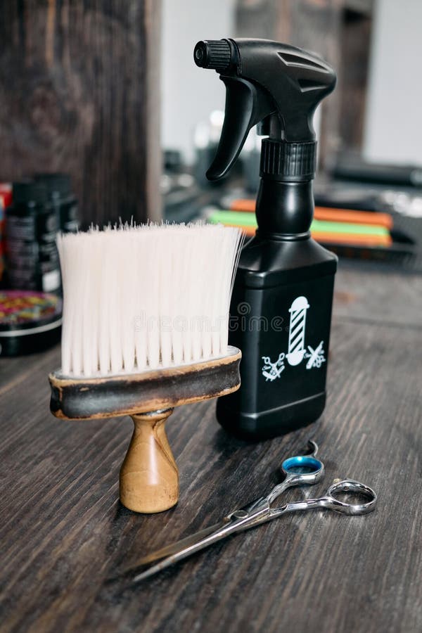 A Variety of Barber Tools are Arranged on a Wooden Table, Including a ...