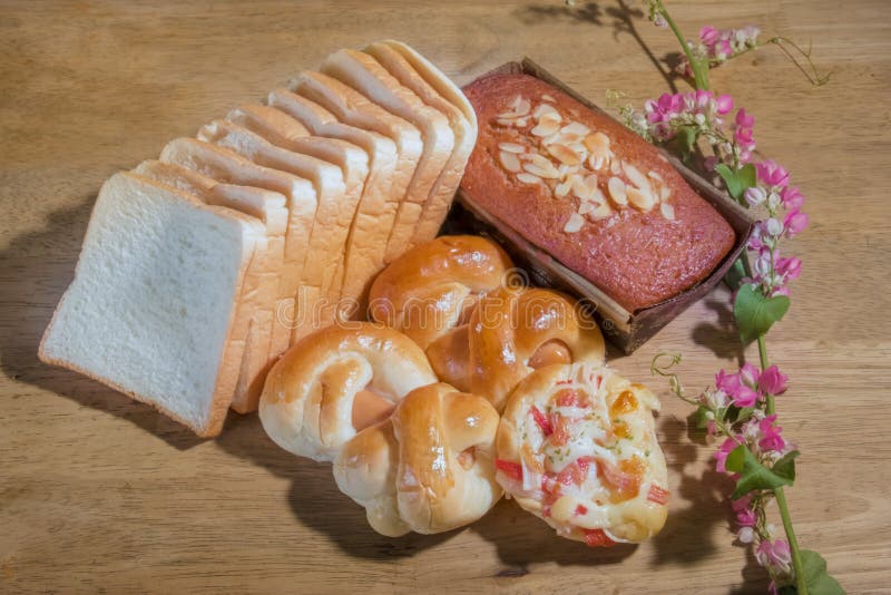 Variety of Bread and Cake on Wood Tabletop Stock Image - Image of ...