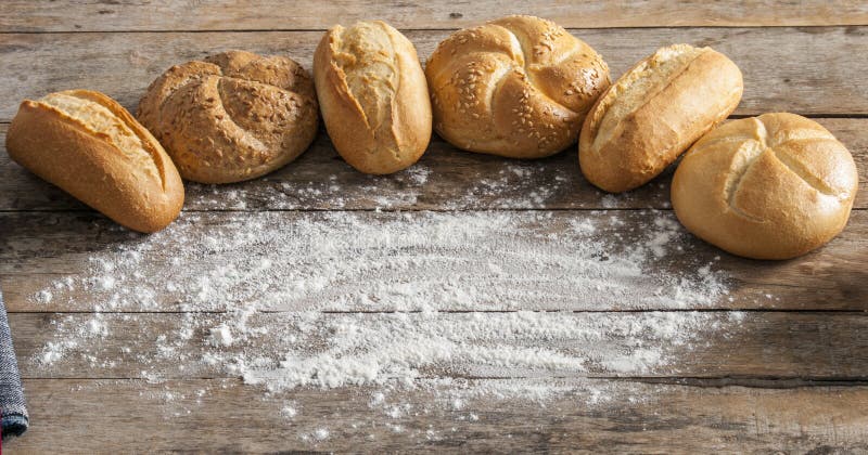 Variety of Bread on a White Wooden Table. Stock Image - Image of view ...