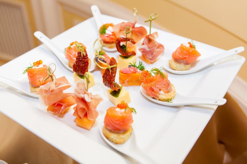 Variety of canapes stock photo. Image of plank, bread - 24609742