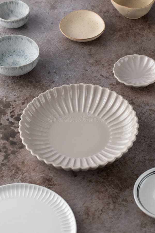 A Variety of Ceramic Empty Plates and Bowls on the Table. Kitchen, Menu ...
