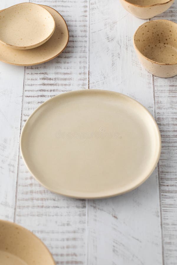 A Variety of Ceramic Empty Plates and Bowls on the Table. Kitchen, Menu ...