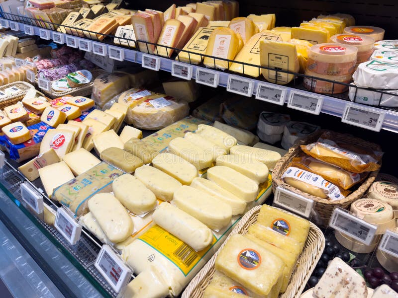 Variety of Cheeses Displayed on Grocery Store Shelf Editorial Stock ...
