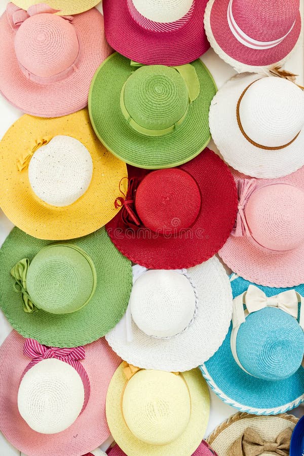 Variety of Colored Straw Hats Hanging on a Wall Stock Photo - Image of ...