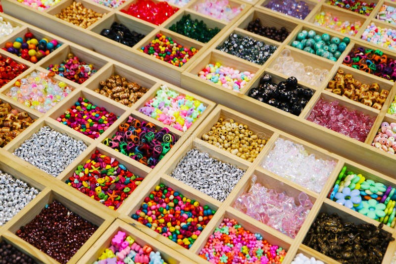Variety of Beads in Wooden Compartment Display Boxes for Beading ...