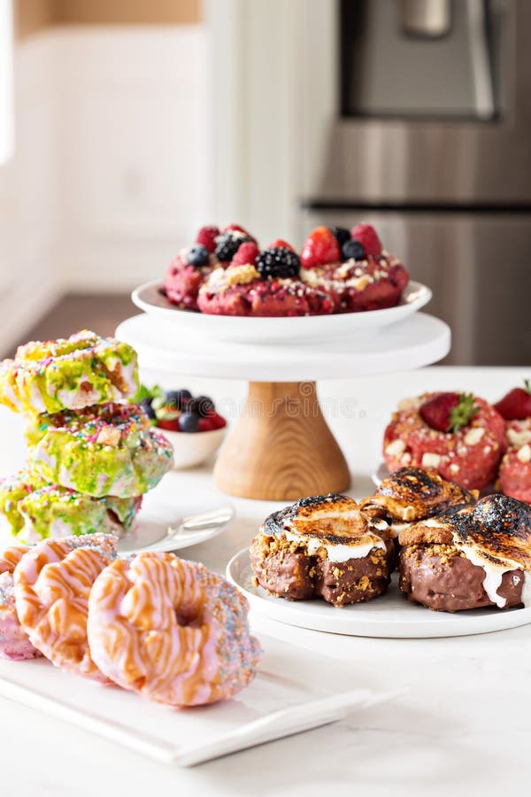 Variety of Donuts on a Table Stock Photo - Image of closeup, frosting ...
