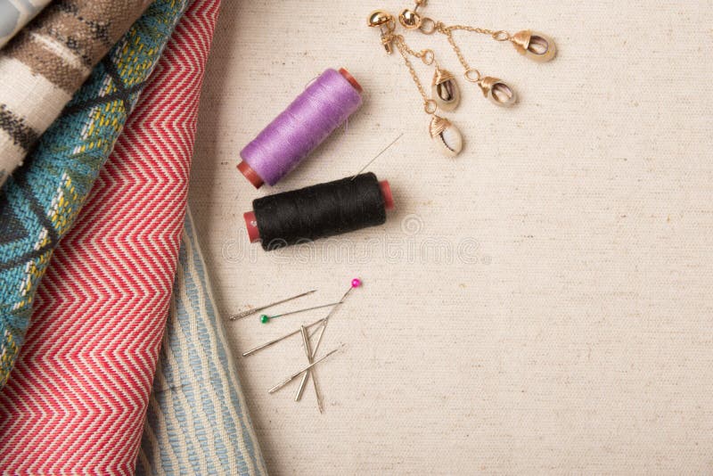 A Variety of Colourful Fabric with Assorted Sewing Pins and Thread Flat ...