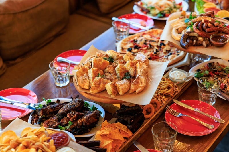 Variety of Delicious Appetizers and Dishes on a Wooden Table Setting ...