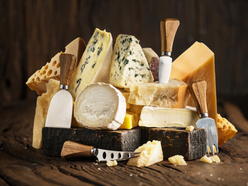 Variety of Different Cheese Chunks on Wooden Table Close Up Stock Image ...