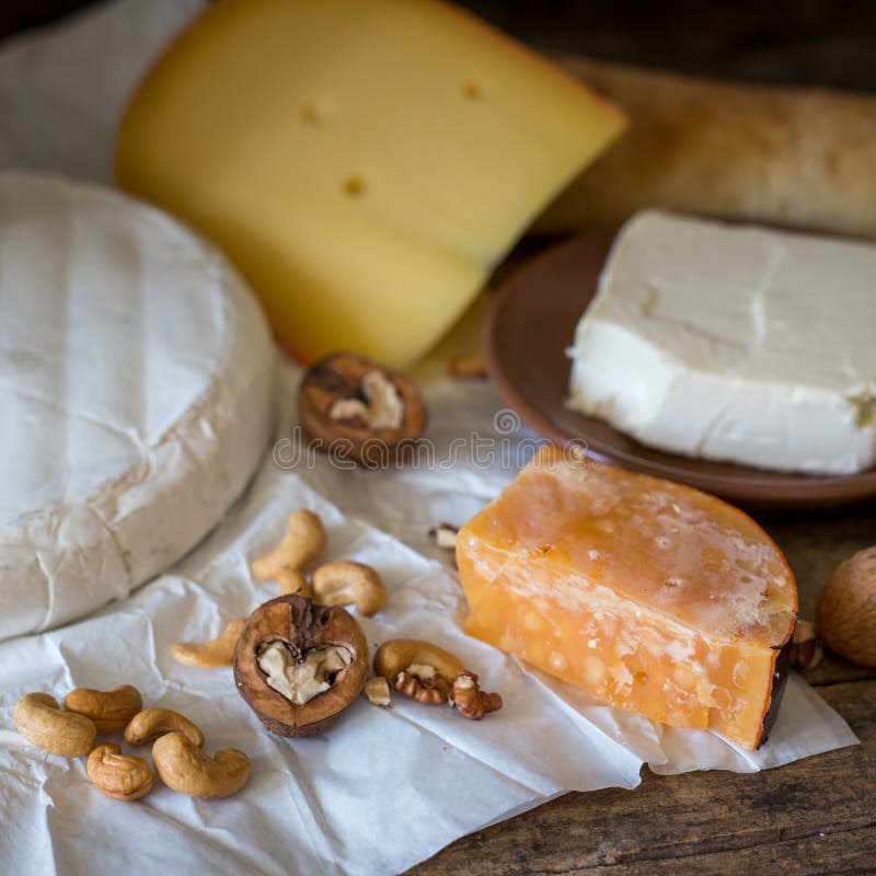Variety of Different Cheese with Nuts on the Table Stock Photo - Image ...