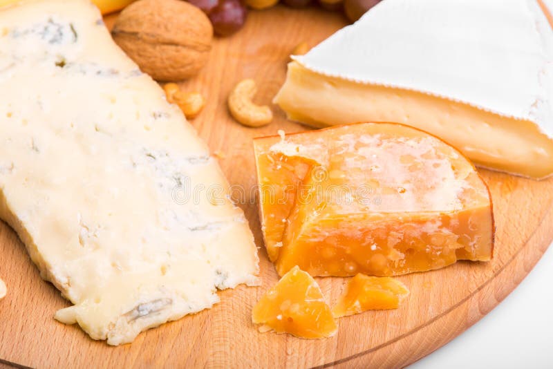 Variety of Different Cheese with Nuts on the Table Stock Photo - Image ...