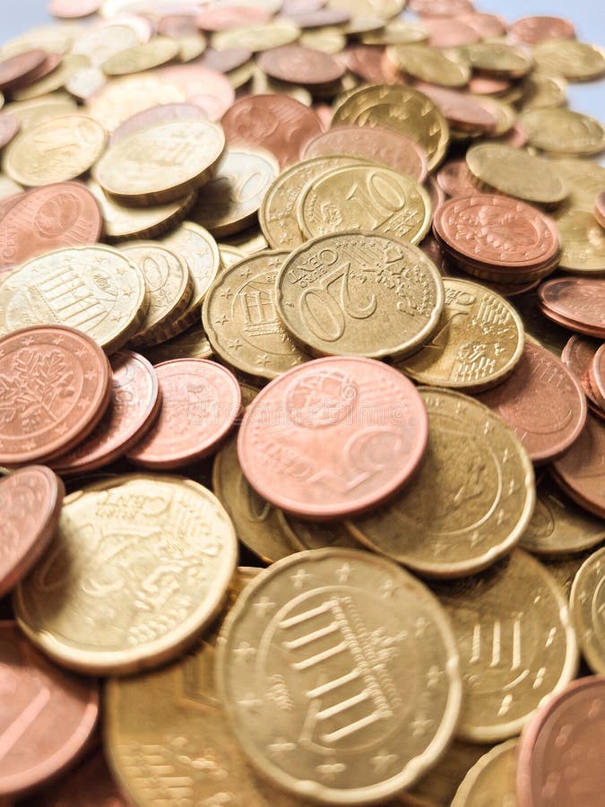 A Variety of Different Coins Piled Together, Displaying Their Unique ...