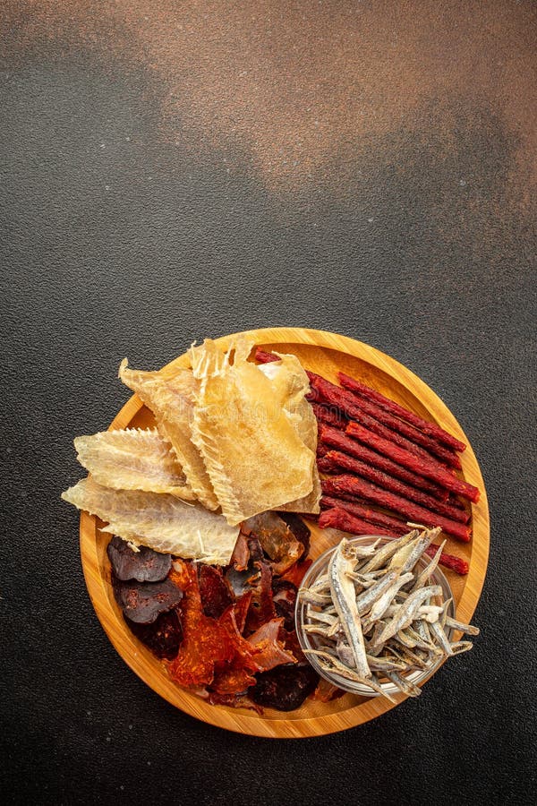 Variety of Dried Fish, Snacks for Beer on a Dark Background. Vertical ...