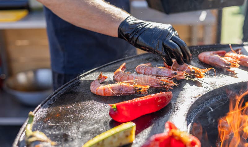 Variety of Food Being Cooked on a Grill. the Food Includes Shrimp, Corn ...