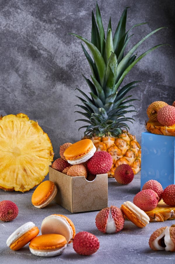 Assorted Fruits Like Pineapple, Lychee, and Macarons Displayed on a ...