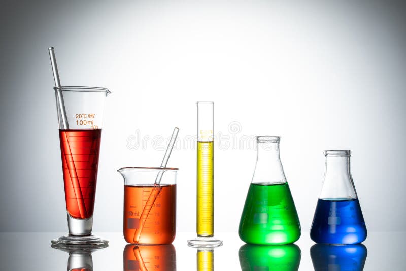 Variety of Glass Flasks and Lab Equipment with Colorful Liquids on a ...