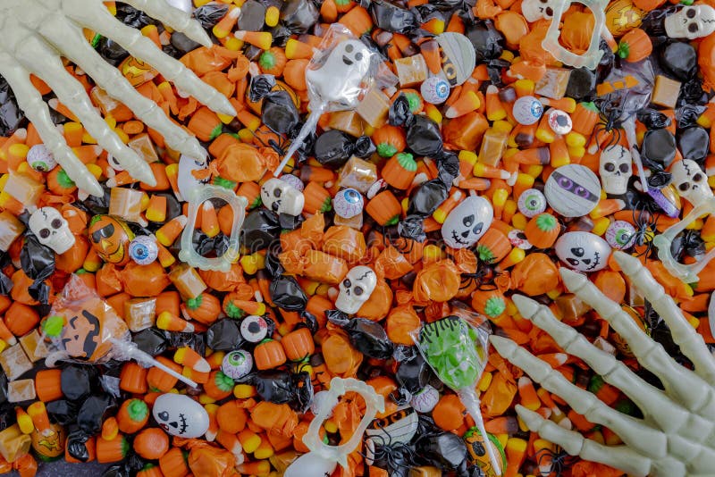 Halloween Candy Spilled Out on Table Stock Photo - Image of candy ...