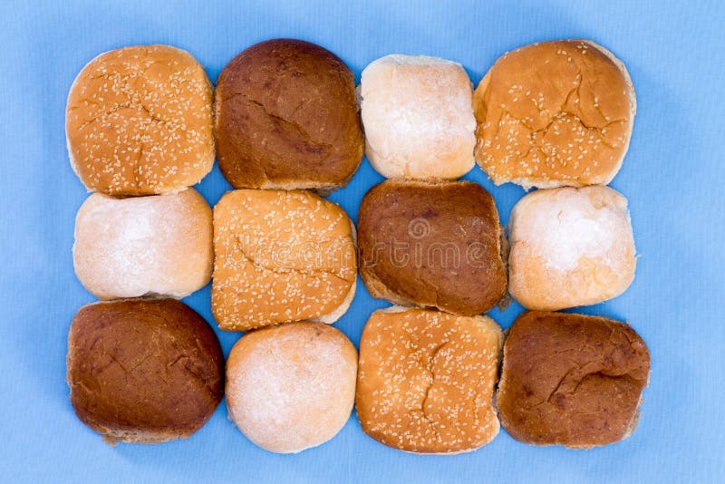 Variety of Hamburger Buns Isolated on Blue Stock Photo - Image of ...