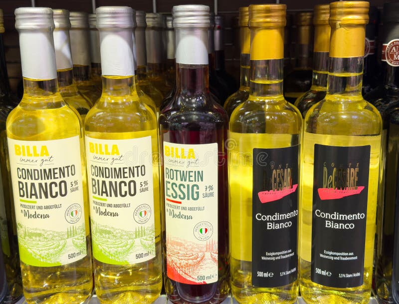 Variety of Italian Condiments and Vinegars Bottles on Store Shelf ...