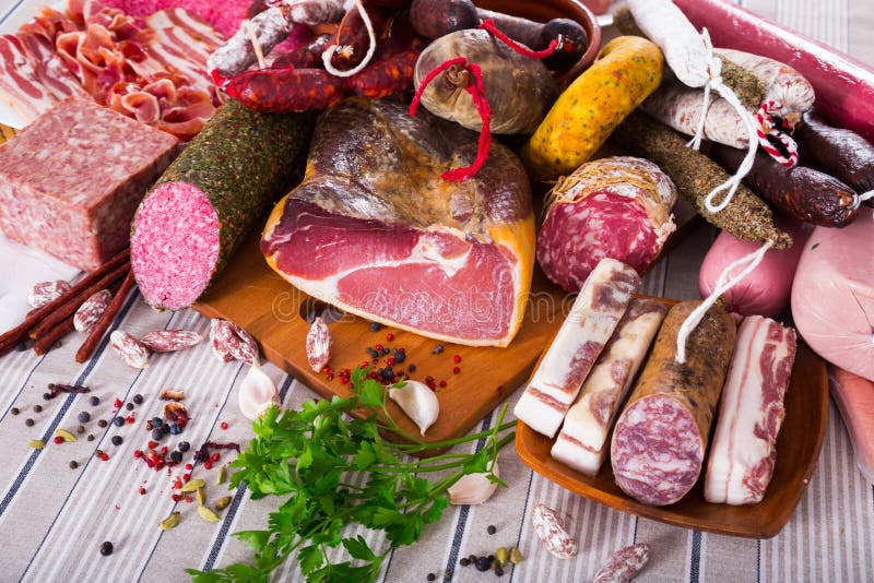 Variety of meats on table stock photo. Image of sliced - 84874096
