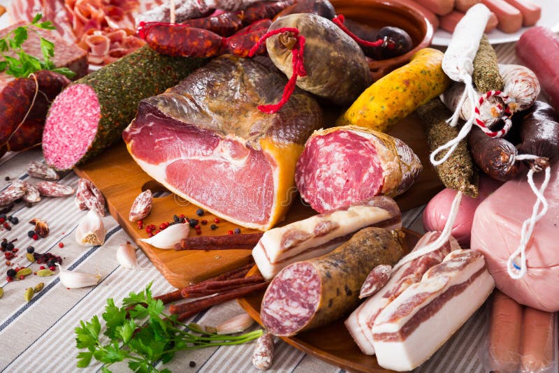 Variety of meats on table stock photo. Image of cuisine - 225642438