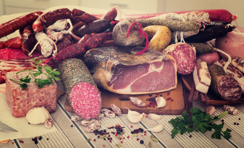 Variety of meats on table stock photo. Image of assortment - 88806578