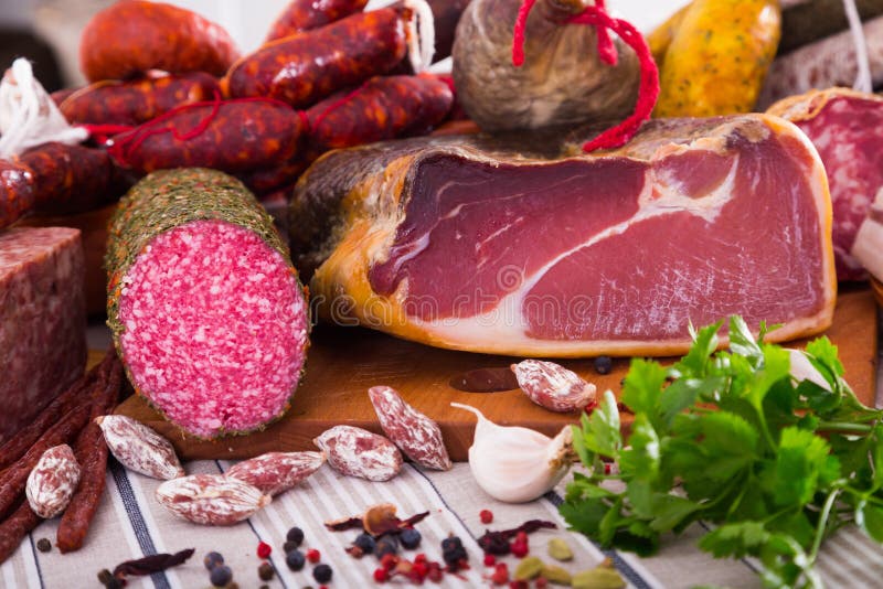 Variety of meats on table stock image. Image of displayed - 94191349