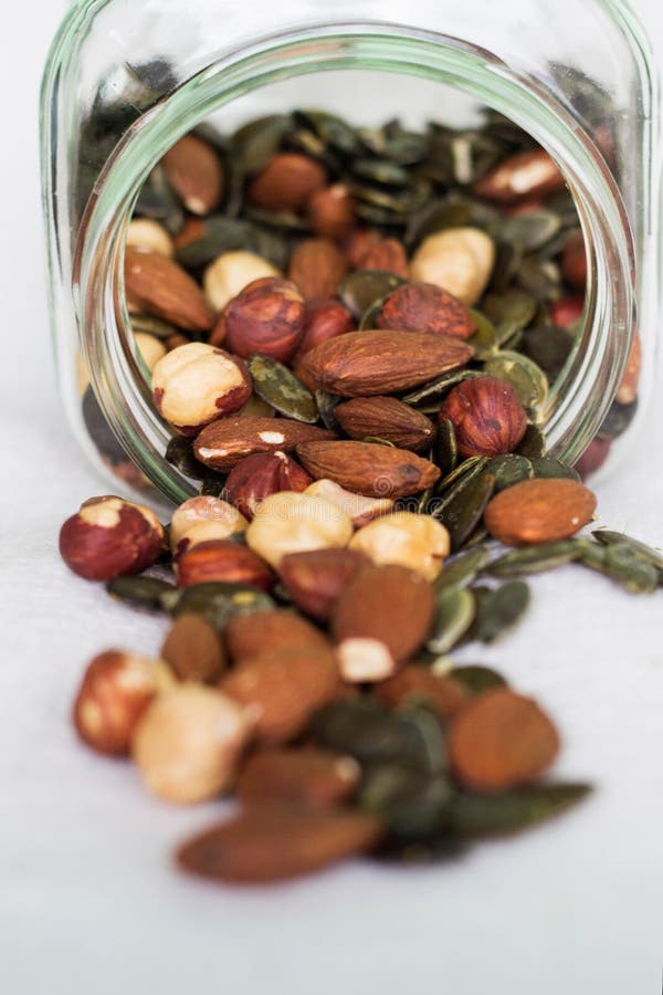 Variety of Nuts Popping Out from Glass Jar Stock Photo - Image of fiber ...