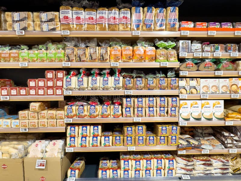 Variety of Packaged Bread and Bakery Products on Grocery Store Shelves ...