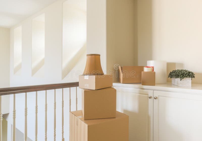Variety of Packed Moving Boxes in Empty Room Stock Photo - Image of ...