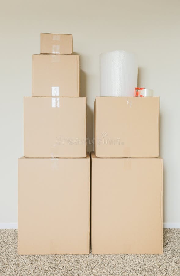Variety of Packed Moving Boxes in Empty Room Stock Image - Image of ...
